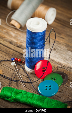 Single spool of blue thread and sewing needle on white background Stock ...