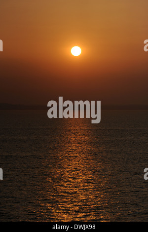 Sunset at the sea Stock Photo - Alamy