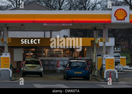 Cars gas up at a Shell gas station in the Long Island City neighborhood of Queens in New York ...