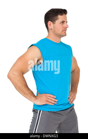 Side view of fit young man exercising outdoors. Muscular young man ...