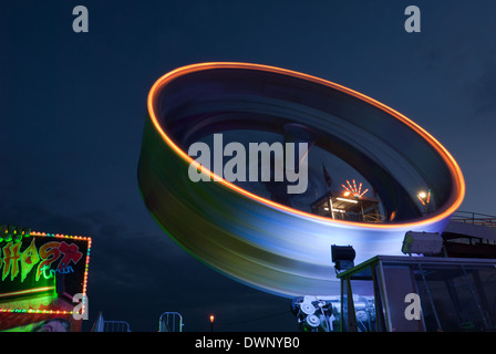 spinning funfair wheel wall of death or round-up standing and ...