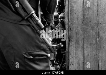Children with armed FARDC Congolese government soldier with a ...