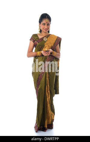 Full body traditional Indian girl in sari costume standing isolated on ...