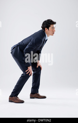 a businessman being wary of something Stock Photo - Alamy