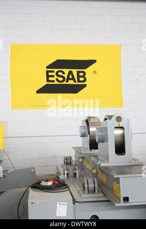 Industrial welding tool in big metal profile background Stock Photo - Alamy