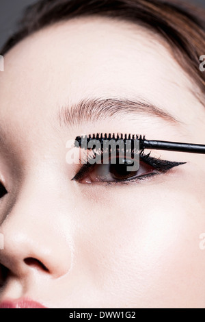 a woman getting a heavy eye make up Stock Photo - Alamy