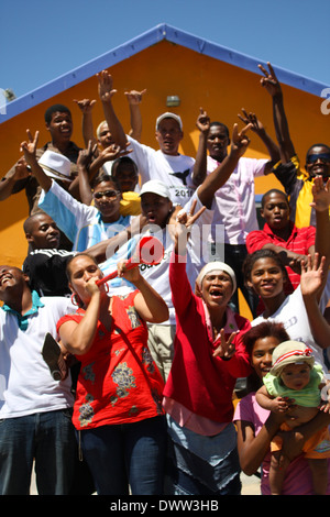 Cheering supporters of the Atlantics and Mountain Birds soccer team in ...