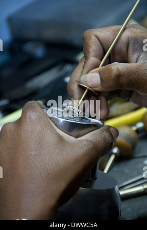 Stone setter Clive Alies ensure the correct and secure setting of ...