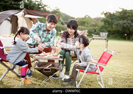 a family out camping Stock Photo - Alamy