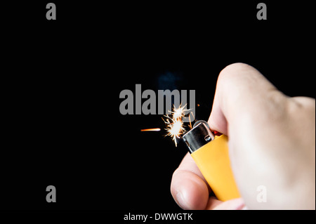 a lighter being light Stock Photo - Alamy