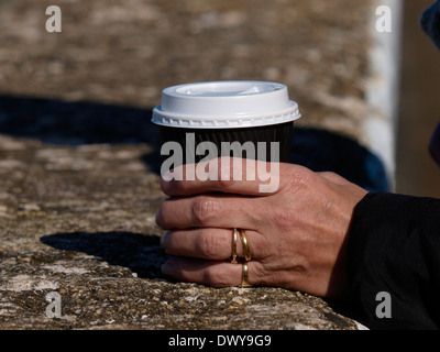 Hand holding take away coffee cup Stock Photo - Alamy