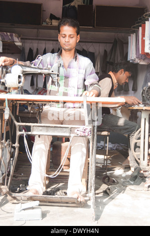 1 Indian Man Stitches clothes Stock Photo - Alamy