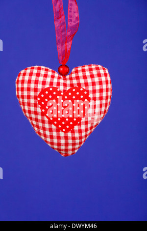 Heart lining on a blue background, with lilac Stock Photo - Alamy