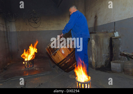 Burning, toasting the barrel with fire. Cooperage, barrel Stock Photo ...