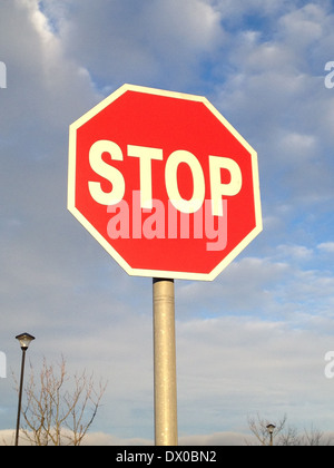 A big red stop sign on the side of a yellow school bus Stock Photo - Alamy