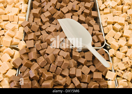 Brown and yellow toffee cubes in a market Stock Photo - Alamy