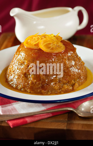 Steamed orange marmalade pudding. Traditional dessert UK Stock Photo ...