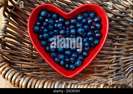 Heart shaped dish of fruits and healthy food with weight scale Stock ...