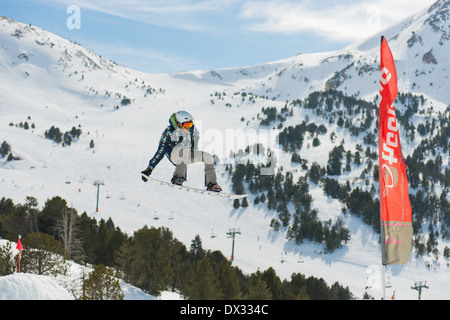 Freestyle Snowboarders jumping and pulling tricks in the winter sports ...