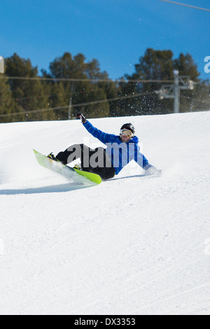 Freestyle ski and snowboarder performing tricks in the winter sport ...