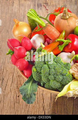 fresh green vegetables on a wooden background. vitamin food Stock Photo ...