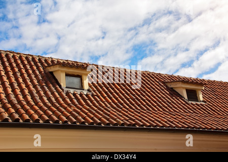 Garret window in tiled roof with old red brick walls Tournai Belgium ...