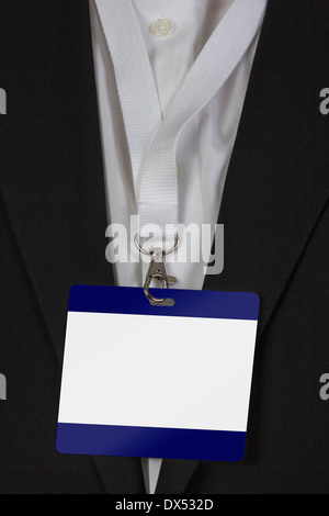man in suite wearing a pass card around his neck Stock Photo - Alamy