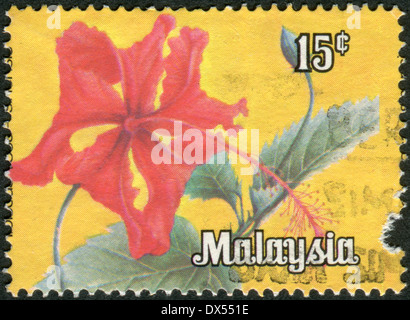 MALAYSIA - CIRCA 1979: a stamp printed in Malaysia shows Rose Mallow ...