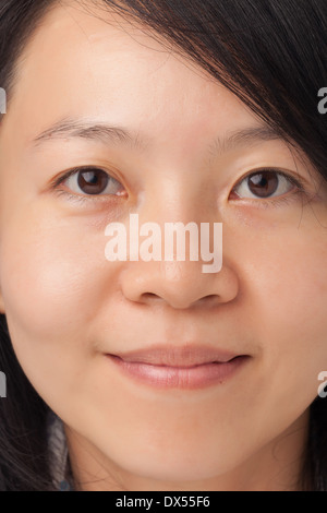 Beautiful Young woman without makeup in a spring park among flowering ...