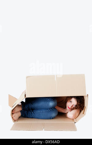 Caucasian red-haired woman sleeps in an embrace with a jack russell ...