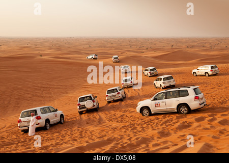 Group of 4 wheel drive cars on a desert safari tour, Dubai, Arabian ...