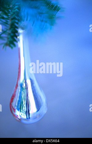Blue Christmas Ornament on Tree with Lights Stock Photo - Alamy