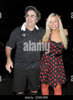 Danny Baker and his daughter leaving a Halloween party held at the home ...