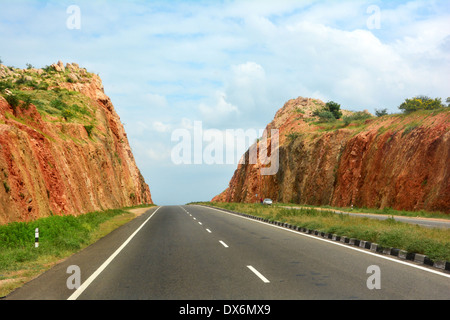 A highway cut through a hill Stock Photo - Alamy