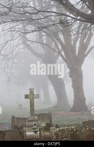 Gravestones in the fog at Banbury Cemetery, Oxfordshire, England ...