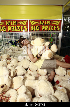 Stuffed bears hanging at amusement park booth, teddy bears, plush toys ...
