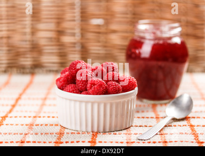 jar with jam and ripe raspberry with mint isolated on white Stock Photo ...