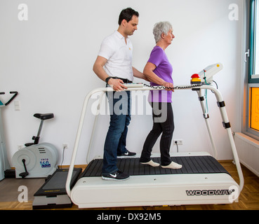 Physiotherapy practice therapist with patient, gait training, running ...