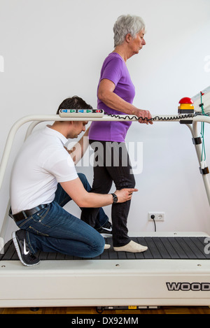 Physiotherapy practice therapist with patient, gait training, running ...