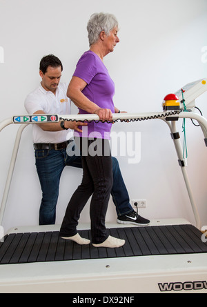 Physiotherapy practice therapist with patient, gait training, running ...