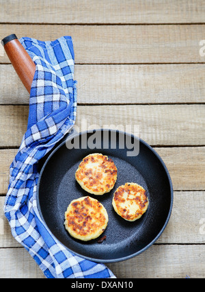 Sweet breakfast cheese pancakes or fritters Syrniki served with berries ...