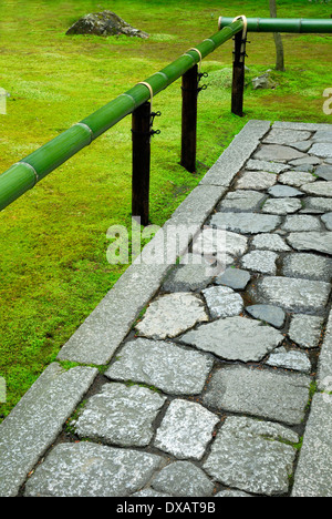 A vertical shot of a stone path in a Japanese zen garden temple Stock ...