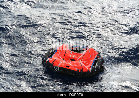 An Isolated Life raft adrift in mid Ocean Stock Photo - Alamy