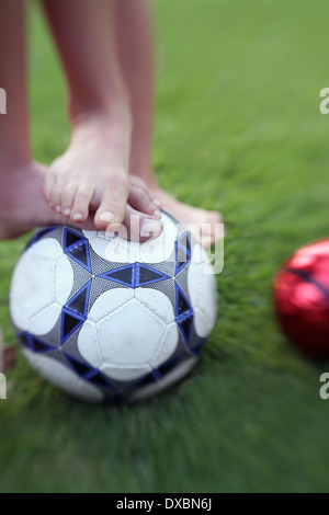 Two childrens feet on grass outdoors in summer park Stock Photo - Alamy