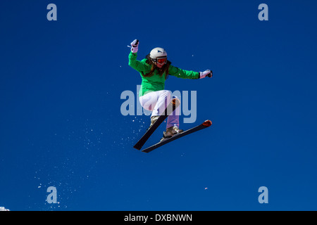 Female skier flying through the air Stock Photo - Alamy
