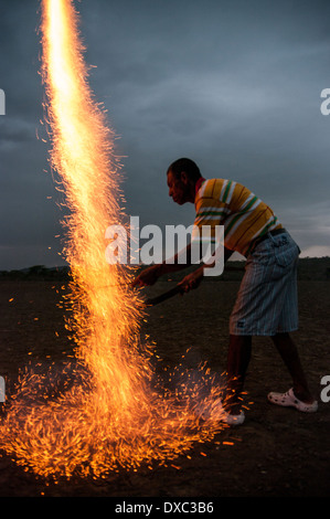 Man lighting fireworks Stock Photo - Alamy