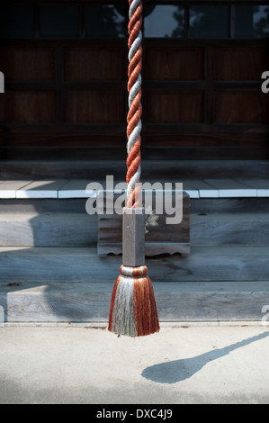 A sacred rope in front of the temple at Japanese Shrine Stock Photo - Alamy