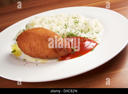 chicken kiev with rice Stock Photo - Alamy