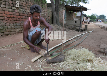 Man preparing the bamboo into strips to make baskets. Leading craft in ...
