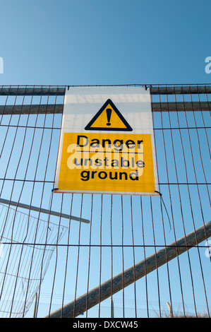 danger unstable ground sign on a metal fence Stock Photo - Alamy